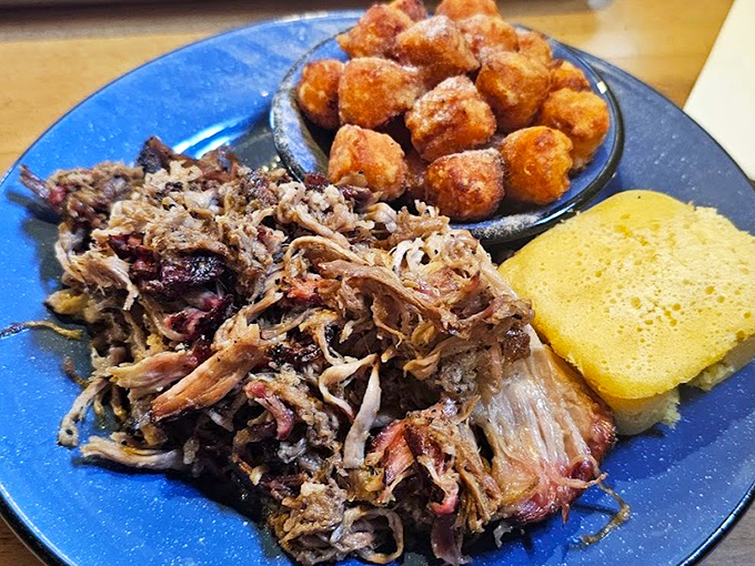Pulled pork with the perfect bark-to-meat ratio, accompanied by hush puppies that could make a Southerner weep with joy.