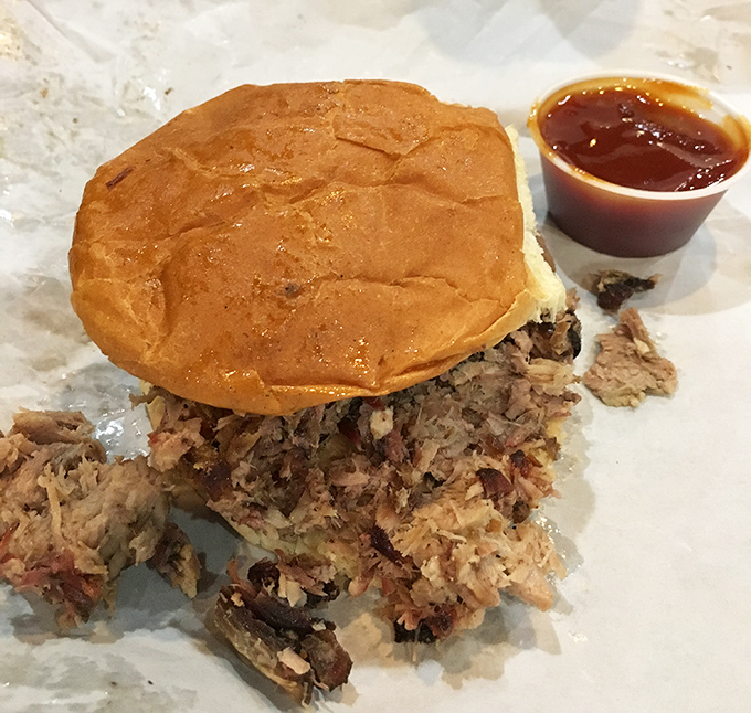 The pulled pork sandwich &ndash; where bread becomes merely a delivery system for smoky, saucy perfection.