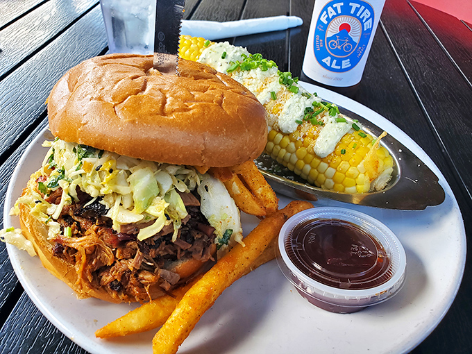 The pulled pork sandwich that launched a thousand road trips. That slaw provides the perfect counterpoint to smoky, tender meat.