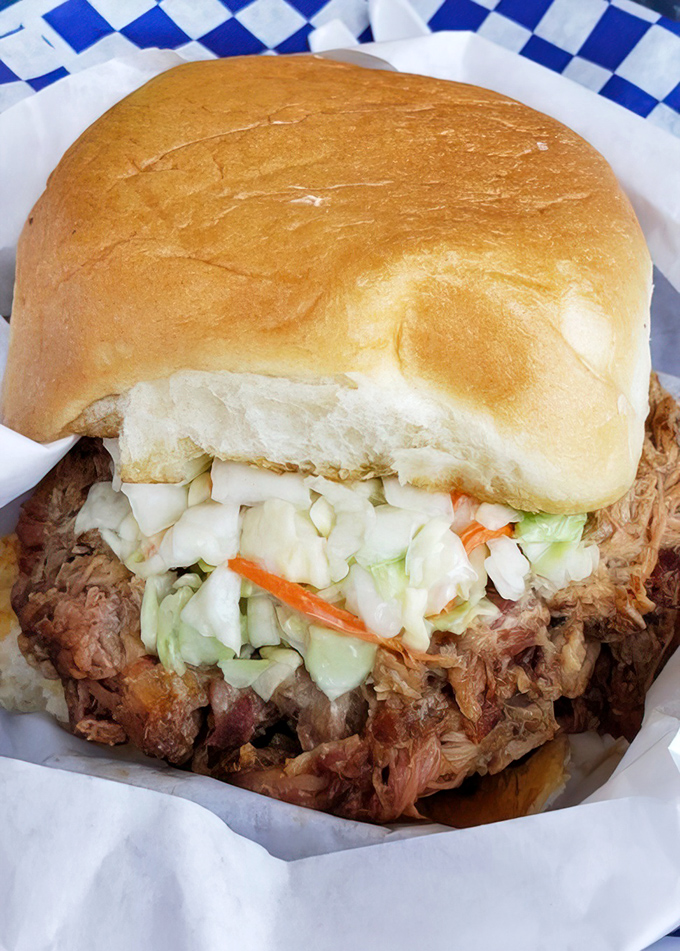 A pulled pork sandwich that doesn't need fancy tricks &ndash; just honest smoke, pillowy bun, and that perfect slaw-to-meat ratio.