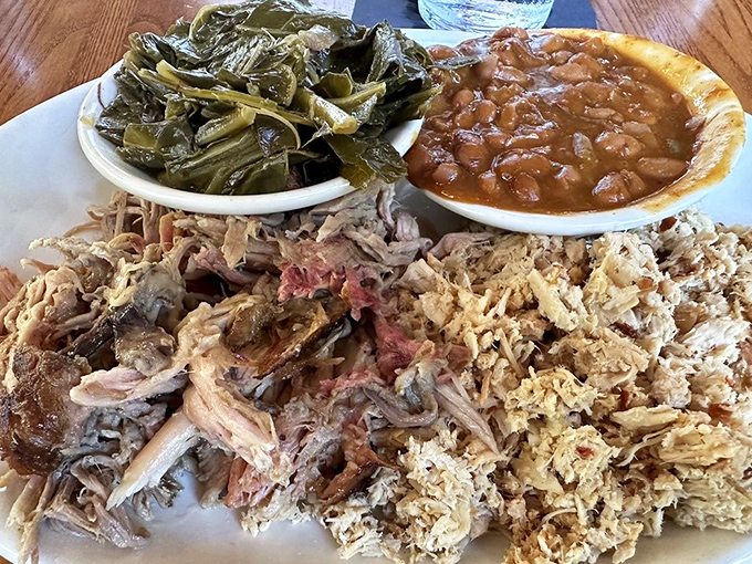 Pulled pork presented with no pretense, just pure perfection. Collards and baked beans stand by as worthy companions to the star of the show.