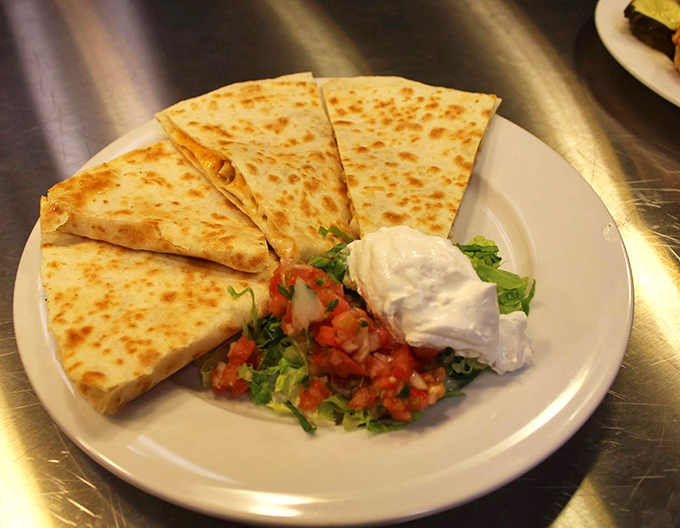 The perfect quesadilla has that golden-brown exterior that makes the satisfying crunch sound you've been dreaming about since your last visit.