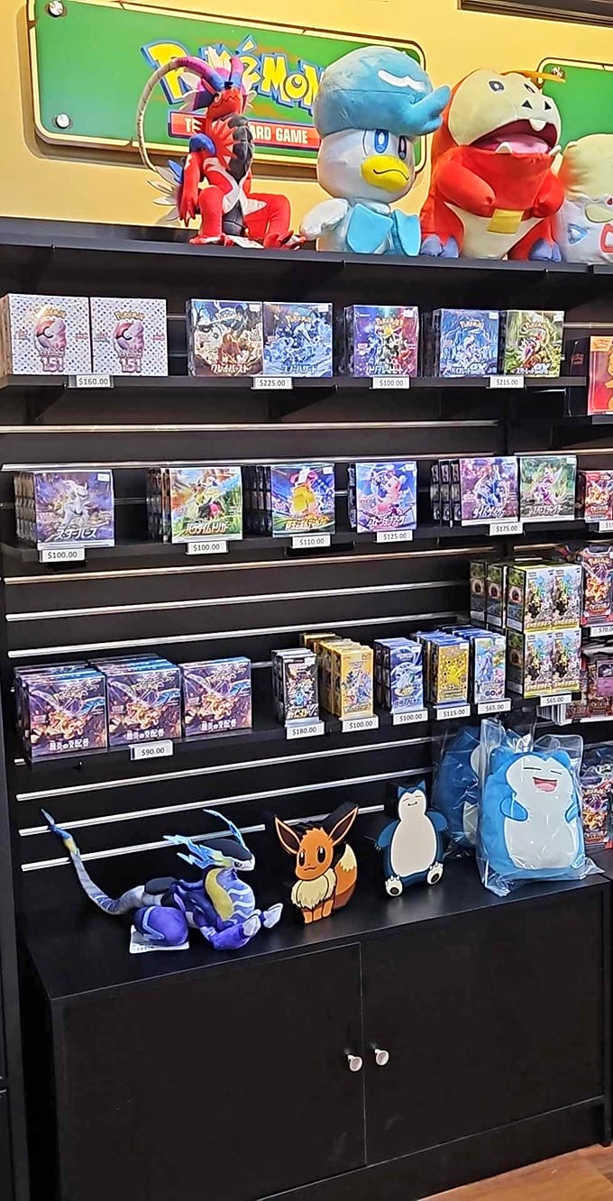 Plush Pok&eacute;mon stand guard over their cardboard counterparts, silently judging your deck-building choices with their adorable button eyes.