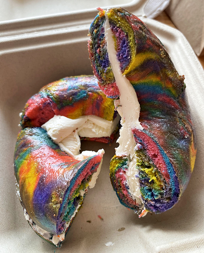 The rainbow bagel with cream cheese: proving that sometimes we eat first with our eyes, especially when breakfast looks like a tie-dye festival.