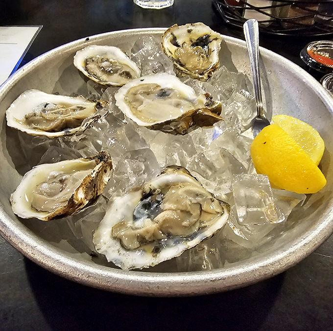 Fresh oysters on ice—nature's perfect appetizer. Like kissing the ocean, but with cocktail sauce and lemon.