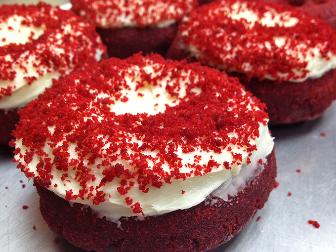 Red velvet donuts with cream cheese frosting: where cake meets donut in a romance that would make Nicholas Sparks weep.