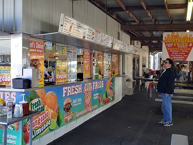 The siren call of fresh-cut fries and lemonade proves that some temptations are worth every calorie and sticky finger.