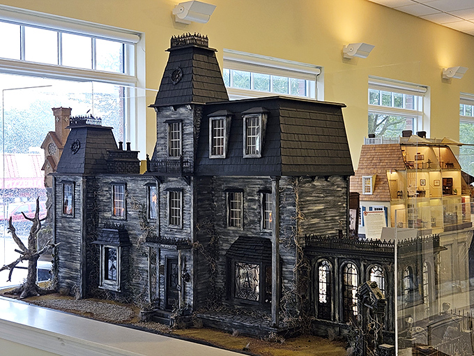 The miniature Addams Family-style mansion brings gothic charm to dollhouse scale. Thing would need really tiny white gloves in this place!