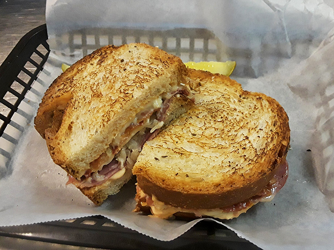 A Reuben that doesn't just satisfy hunger—it negotiates a peace treaty between corned beef and sauerkraut that should win a Nobel Prize.