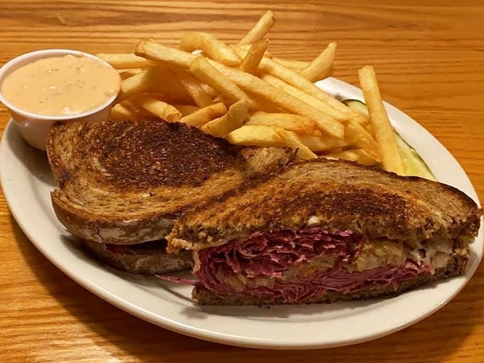 The Reuben sandwich: where perfectly grilled rye bread meets a mountain of corned beef in what can only be described as a delicious handshake.