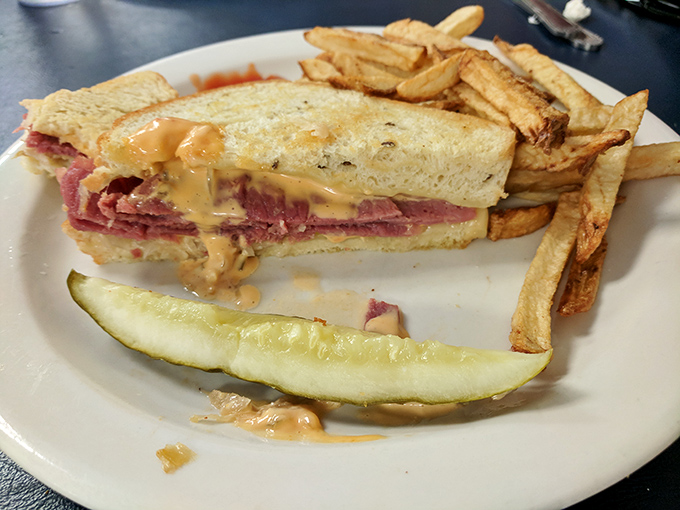The Reuben sandwich: where corned beef, sauerkraut, and Swiss cheese perform a perfect harmony that would make the Amish put down their plows and applaud.