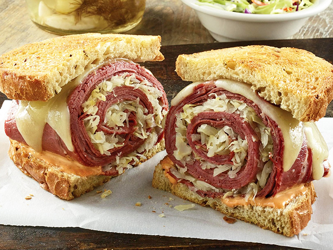 The Reuben sandwich&mdash;where corned beef, sauerkraut, Swiss cheese, and Russian dressing perform a perfectly choreographed dance between grilled rye bread.