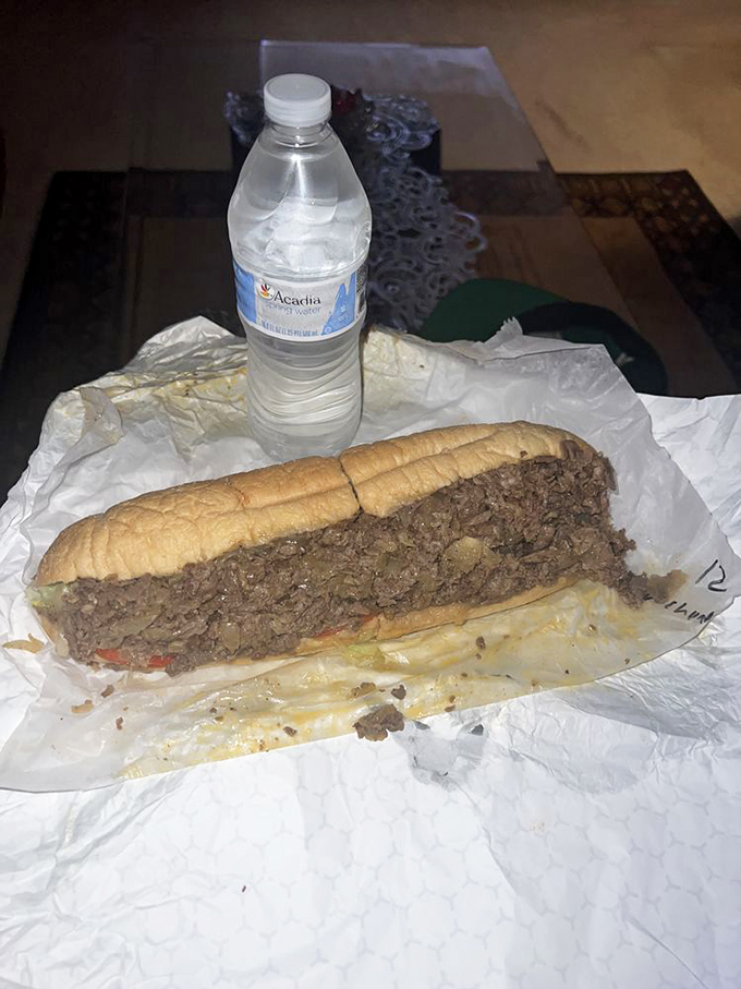 The main event in its natural habitat&mdash;paper-wrapped perfection. This cheesesteak isn't just a meal; it's a meditation on simplicity done right.