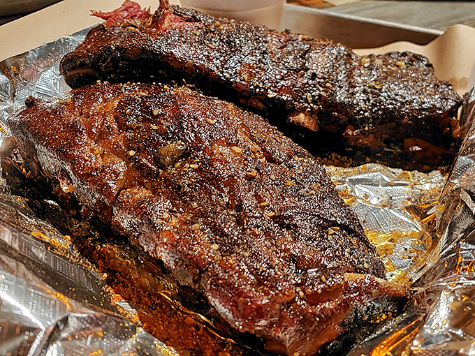 These ribs have that perfect bark-to-meat ratio that BBQ dreams are made of&mdash;the kind that makes you temporarily forget table manners exist.