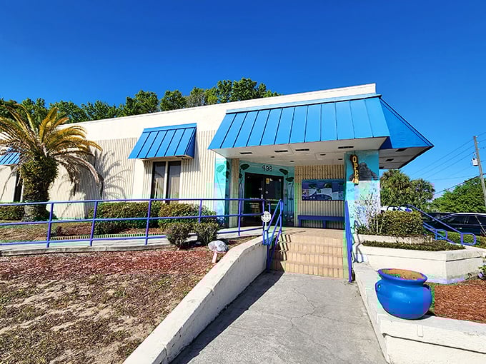 The blue awnings of River Ventures welcome visitors seeking manatee encounters without the crowds and prices of Florida's more famous attractions.