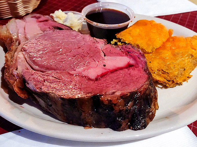Prime rib so perfectly pink it could make a vegetarian question their life choices, served with that signature square of golden tamale pie.