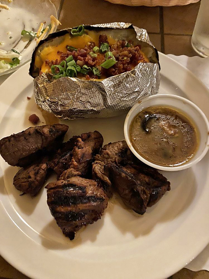 Steak tips with a loaded baked potato &ndash; proof that sometimes the supporting actors deserve just as much applause as the headliners.