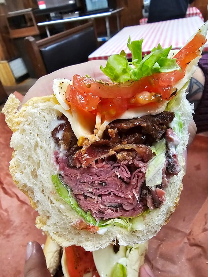 Layer upon layer of roast beef creates a carnivore's dream. This isn't just lunch; it's a commitment to excellence between two slices of bread.