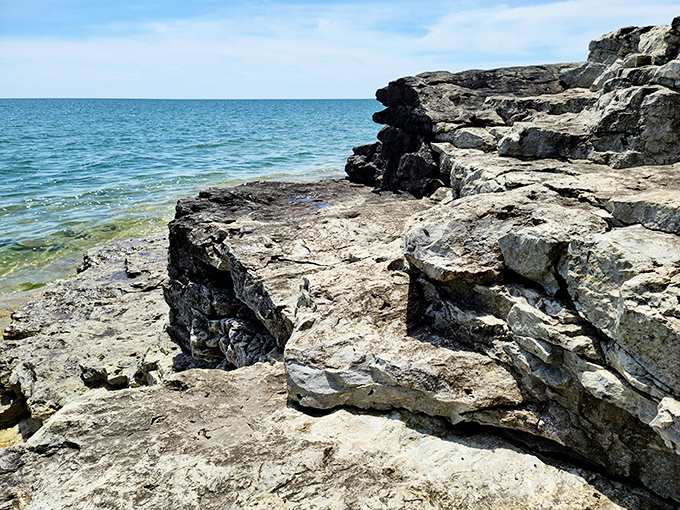 These ancient rocks have been perfecting their shoreline arrangement for thousands of years—talk about dedication to interior design.