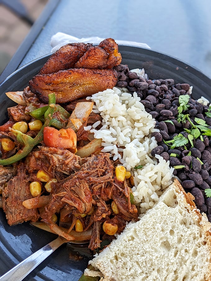 Ropa Vieja that transports you straight to Havana &ndash; tender shredded beef swimming in a sea of vibrant vegetables with plantains standing guard.