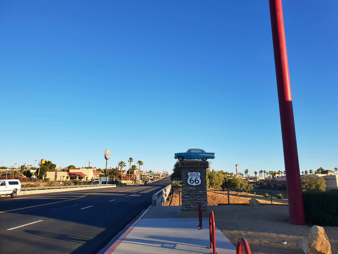 That classic Route 66 signage – proof you're standing on the legendary highway where mid-century America found its freedom on four wheels.