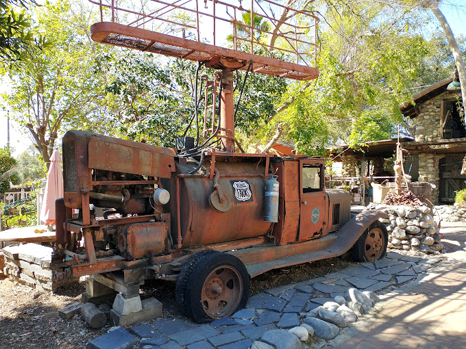 This vintage fire truck didn't retire&mdash;it reinvented itself as castle yard art. Even emergency vehicles deserve a peaceful second act in paradise.