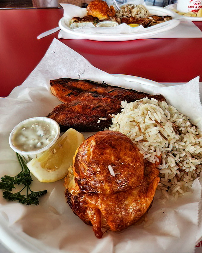 The seafood trifecta: perfectly grilled fish, a golden crab cake, and rice pilaf&mdash;proof that sometimes the simplest combinations create the most memorable meals.
