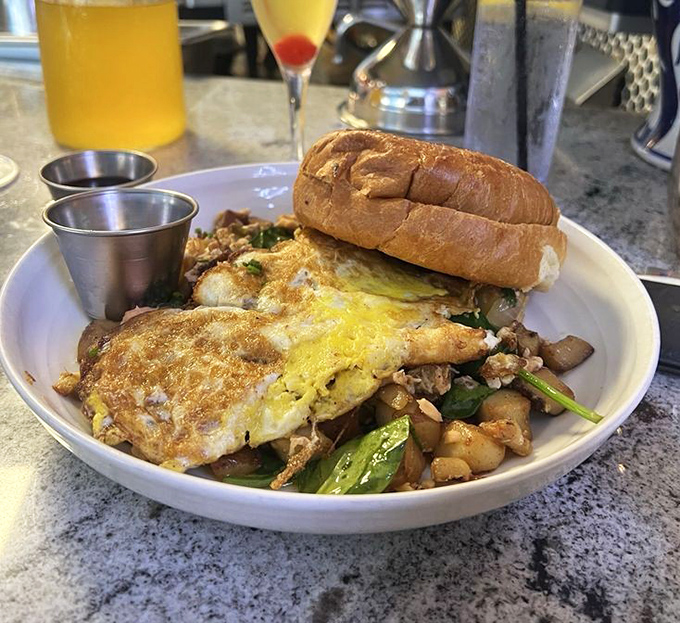 Breakfast alchemy at its finest: eggs, potatoes, and greens transformed into a morning masterpiece that makes hitting the snooze button seem like a crime.