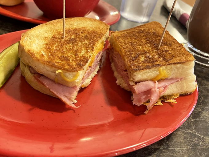 Sandwich architecture at its finest. Golden-grilled bread embraces ham and cheese in a warm hug that puts ordinary lunches to shame.