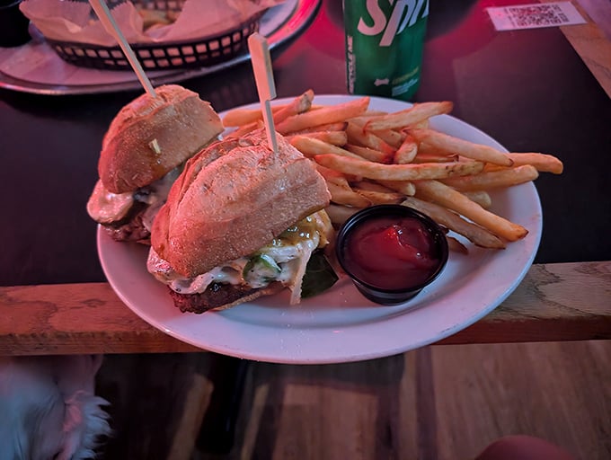 A sandwich that requires both hands and your full attention. Those golden fries aren't just a side&mdash;they're co-stars in this delicious production.