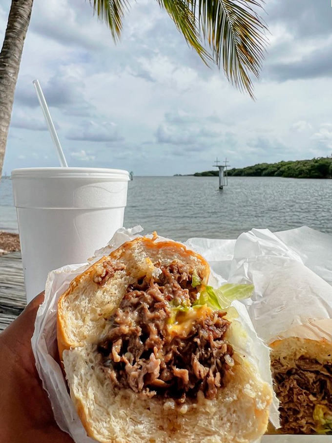 Some views improve everything you eat. This sandwich found its perfect Florida backdrop&mdash;palm trees, water, and handheld deliciousness.