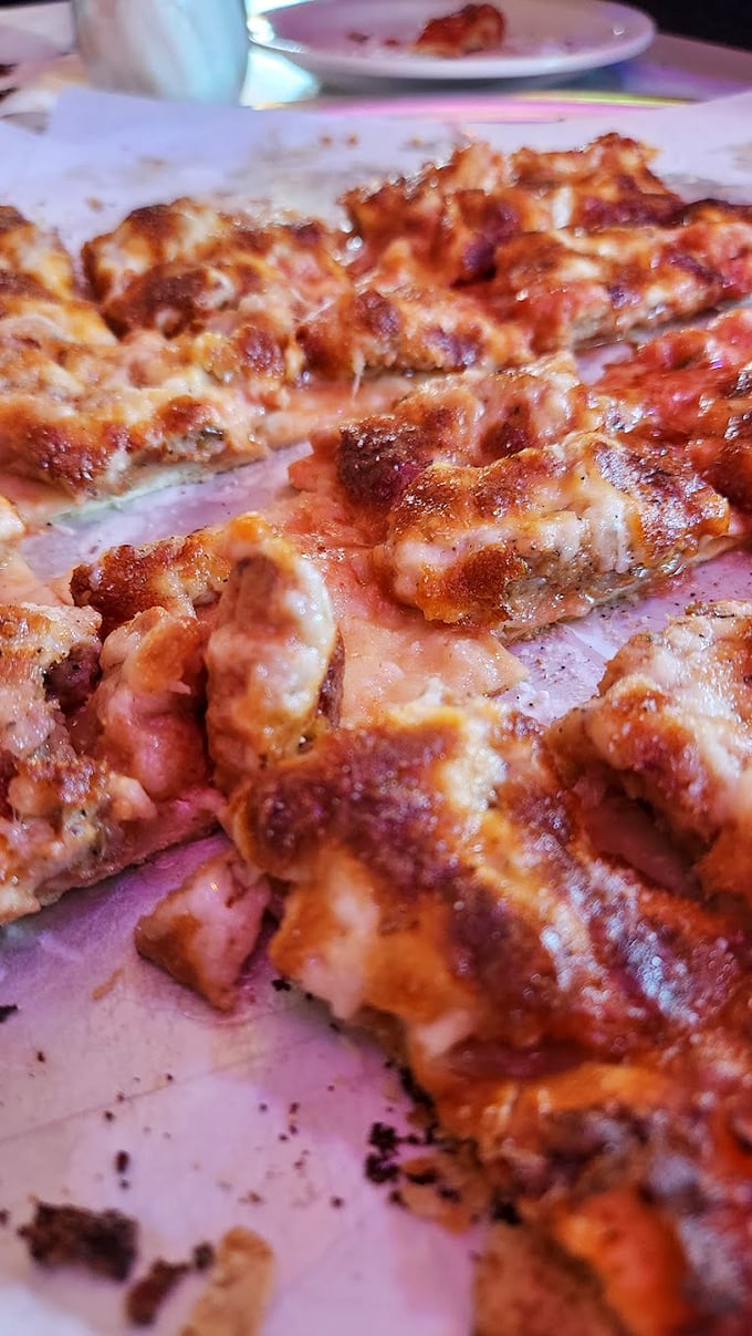 Look at that sausage distribution! Like stars in a meaty galaxy, each bite delivers the perfect ratio of spice to cheese.