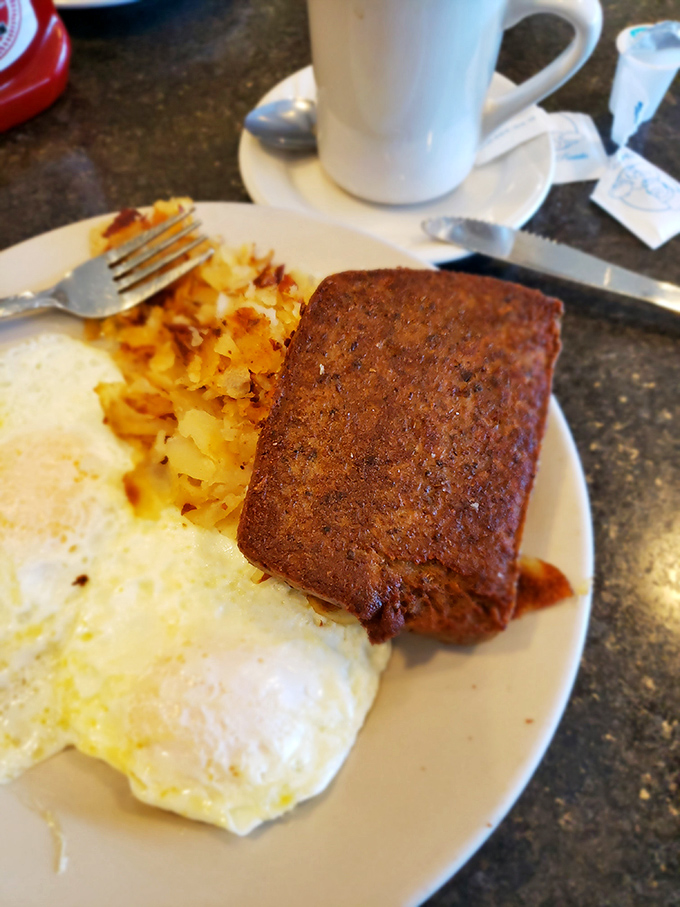 Breakfast perfection doesn't need fancy plating. Just eggs cooked exactly how you asked, crispy hash browns, and scrapple that would make a Pennsylvanian shed a tear of joy.