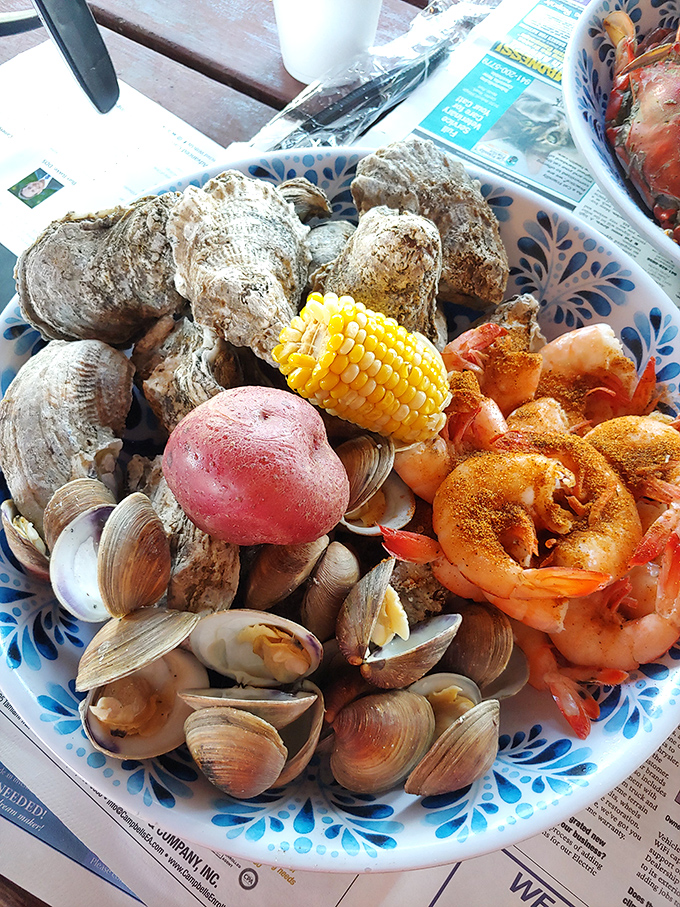 The seafood sampler that makes decisions unnecessary. Oysters, clams, shrimp, and corn&mdash;a maritime block party on a plate.