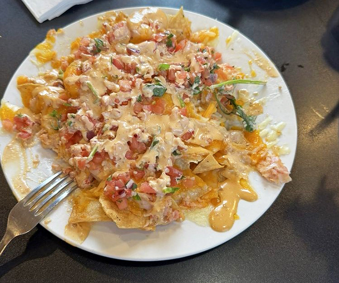 Seafood nachos that break all the rules in the best possible way. Who knew tortilla chips could make such magnificent vessels?