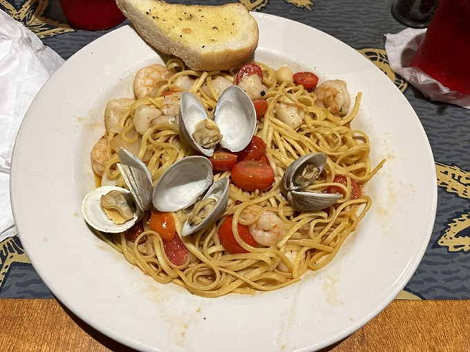 A seafood pasta that's having a party and invited clams, shrimp, and cherry tomatoes. Your fork should RSVP immediately.