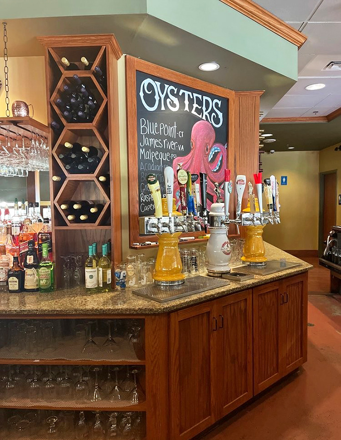 The oyster bar showcases daily selections with that playful octopus reminding everyone who rules these waters.