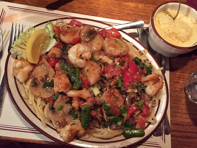Pasta playing the supporting role to perfectly saut&eacute;ed shrimp and vegetables&mdash;a seafood symphony where every bite hits the right note. 