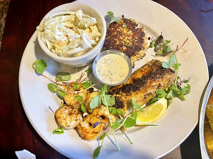 The seafood trinity: perfectly blackened fish, succulent shrimp, and creamy slaw. Like the ocean's greatest hits album served on a single plate.