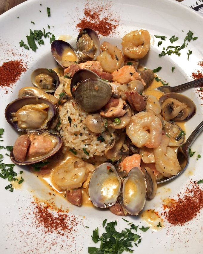 The seafood jambalaya arrives like a treasure chest of oceanic delights&mdash;clams, shrimp, and fish nestled in a savory sauce that demands to be sopped up with bread.