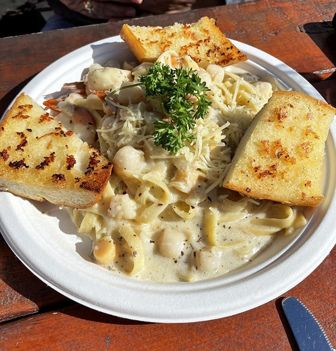 Seafood pasta that doesn't skimp on the stars of the show. Those scallops and prawns aren't hiding in the cream sauce; they're taking a luxurious bath in it.