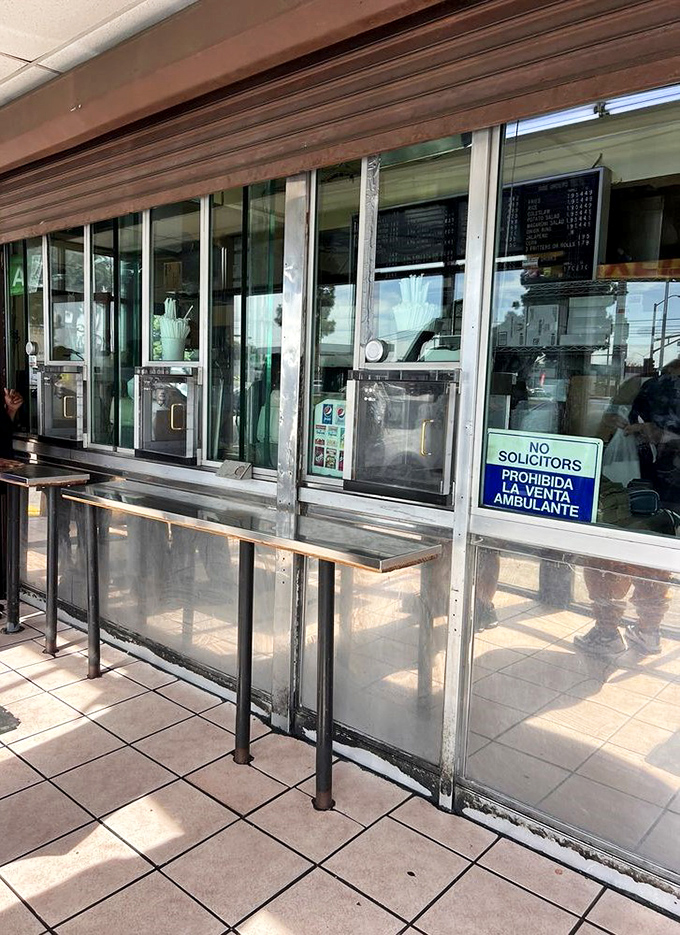 The no-frills serving window where culinary dreams come true, one paper bag of chicken at a time.