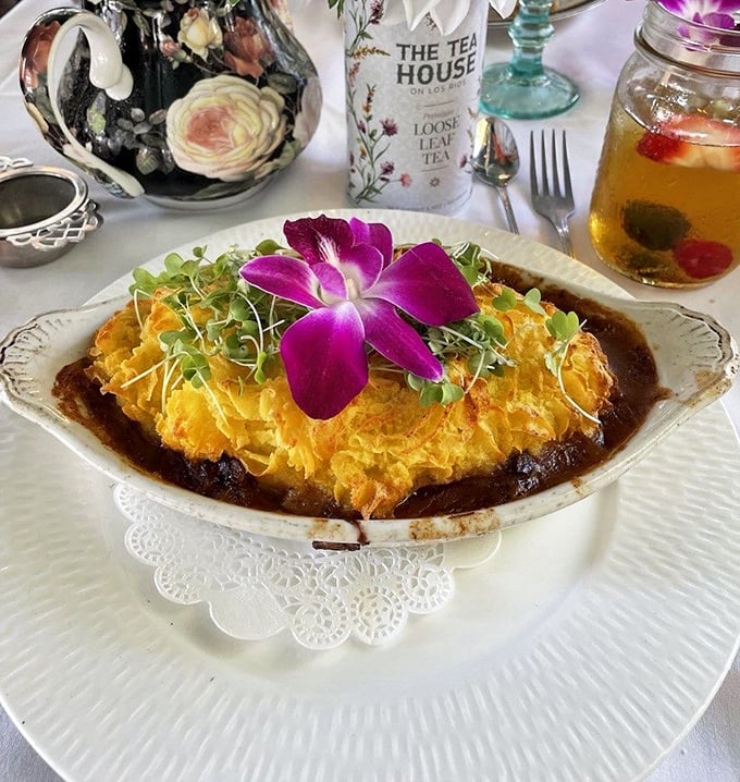 This isn't just Shepherd's Pie&mdash;it's a golden-topped masterpiece crowned with an orchid. Even shepherds deserve a little luxury.