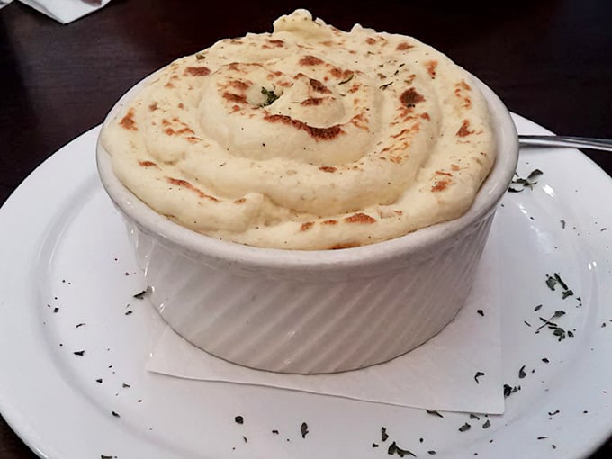 Shepherd's pie that would make any actual shepherd abandon his flock. That browned cheese top is basically edible sunshine.