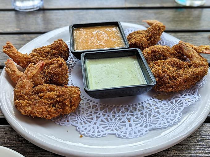 These aren't your carnival-variety fried shrimp. Perfectly golden and crisp, they're served with dipping sauces worth fighting over.