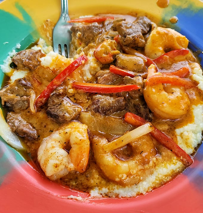Shrimp and grits with Andouille sausage—where New Orleans romance meets Florida seafood in a bowl that demands to be savored slowly.