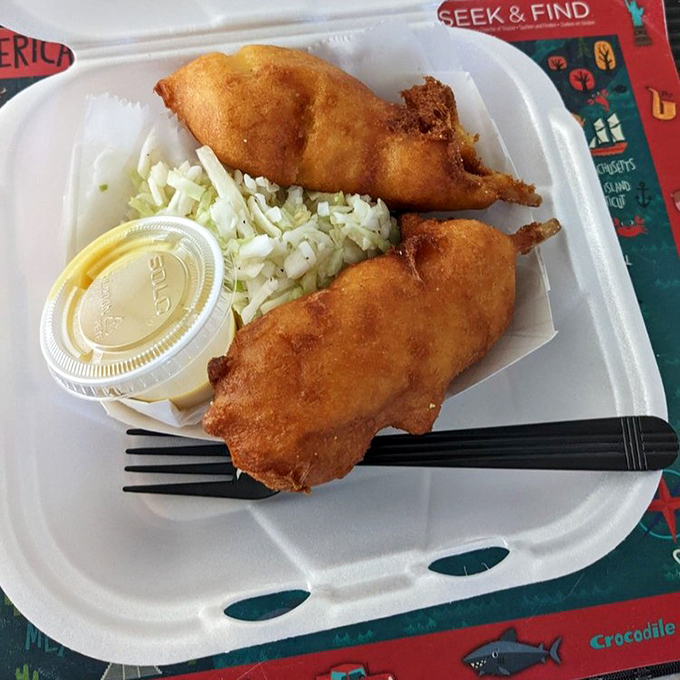 Shrimp corn dogs served with coleslaw - because sometimes genius comes in unexpected packages.