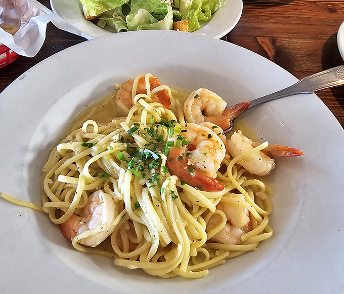 Shrimp scampi that whispers "vacation" with every bite&mdash;plump shrimp and al dente pasta bathed in garlic-infused goodness.