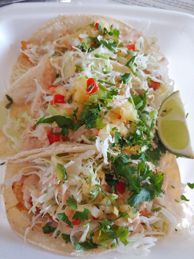 These fish tacos are poetry on a plate &ndash; crispy battered fish, crunchy cabbage, zesty pico, and that signature white sauce create the perfect bite every time.