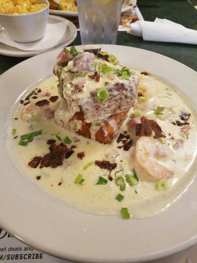 Shrimp and grits swimming in a sea of creamy goodness. If comfort food were an Olympic event, this dish would be taking home gold.